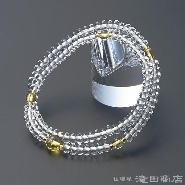 珠の素材：本水晶 みかん玉 主珠108個　　　　　親珠・四天珠に黄水晶を使用中糸の素材：オペロンゴム（シリコンゴム）サイズ：内周 約16.5cm〜約17.5cm宗派：すべての宗派でお使いいただけます備考：携帯用ポーチ袋付き本式数珠と同じ仕様...