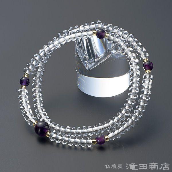 珠の素材：本水晶 みかん玉 主珠108個　　　　　親珠・四天珠に紫水晶を使用中糸の素材：オペロンゴム（シリコンゴム）サイズ：内周 約16.5cm〜約17.5cm宗派：すべての宗派でお使いいただけます備考：携帯用ポーチ袋付き本式数珠と同じ仕様...
