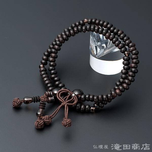 珠の素材：縞黒檀（艶消） 主珠108個　　　　　親珠・四天珠に茶水晶を使用中糸の素材：オペロンゴム（シリコンゴム）サイズ：内周 約16.5cm〜約18cm　　　　※サイズ変更不可宗派：浄土真宗の本式数珠ブレスレット備考：携帯用ポーチ袋付き浄...