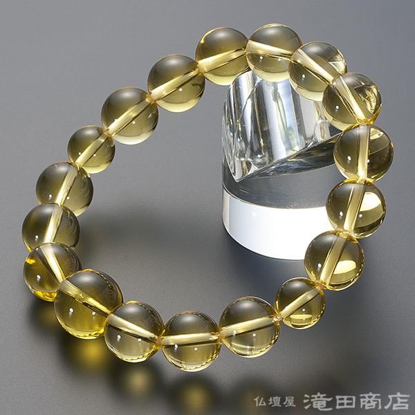 珠の素材：黄水晶 12mm玉中糸の素材：オペロンゴム（シリコンゴム）サイズ：下記のサイズよりお選び下さい　　　　・内周 約17cm　　　　・内周 約18cm備考：携帯用ポーチ袋付き黄水晶の12mm玉を使用した腕輪念珠（ブレスレット）です。中...