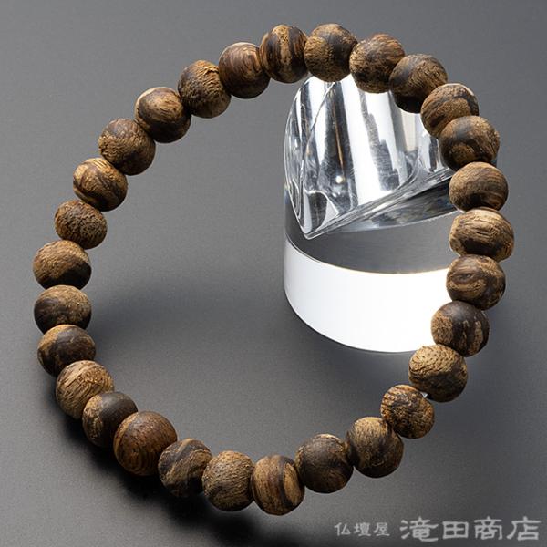 珠の素材：極上 伽羅（きゃら） 8mm玉中糸の素材：オペロンゴム（シリコンゴム）サイズ：内周 約17.5cm備考：携帯用ポーチ袋付き、桐箱入り天然木の腕輪念珠（ブレスレット）です。極上 伽羅（きゃら）の約8mm×7mm玉を使用しました。中糸...