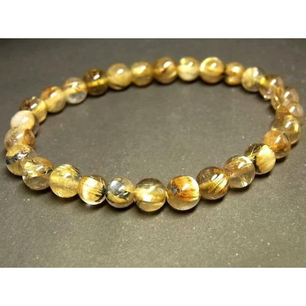 パワーストーン 天然石 ルチルクォーツ ブレスレット 限定1点 水晶 開運 金運　 ★サイズ：玉直径約6〜7ｍｍ 腕回り約15ｃｍ 重さ約11ｇ★商品状態：天然形成のギラギラと黄金色に輝くタイチンルチルが透明度が高い水晶の中にびっしり入って...