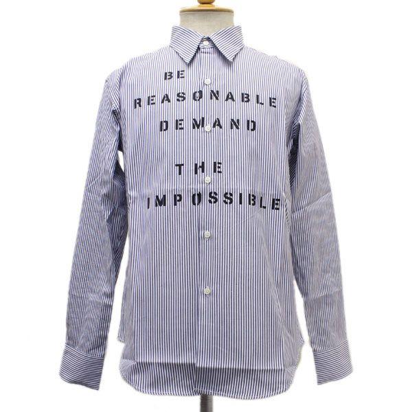 正規取扱店 THREE WOOD。Be Reasonable Demand The Impossible(筋を通し不可能を要求せよ)というスローガンが、胸にステンシルプリントされたシャツの復刻品。マルコム、ヴィヴィアン、ポール・クックが着用...