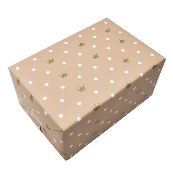 クラフト紙に白い円と王冠の図柄。