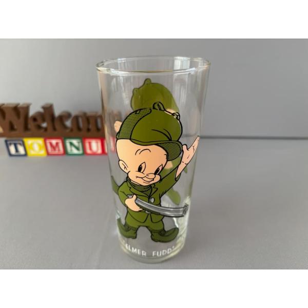 1973年のペプシコレクターシリーズのグラスです。ワーナーブラザースのルーニーチューンズの個性豊かなキャラクターはどれも可愛くて集めたくなります。こちらはフェデラル社製のエルマーファッドです。状態：ワレ・カケありません。フチ部分の凹凸は製造...