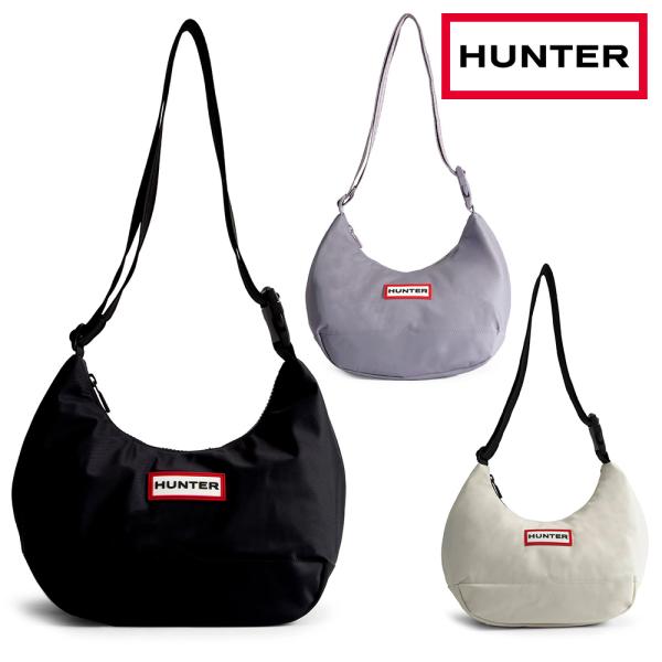 HUNTERハンター NYLON MIDI HOBOUBS3601KBMブラック:BLKドリーミーライラック:DRLソフトサンド:SFDナイロンミディホーボーは、半月型のデイリーユースに最適な新しいシルエットのバックです。外側は耐水性のリサ...