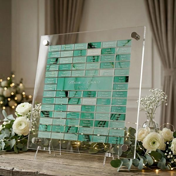おしゃれなエメラルドグリーンカラーのゲスト様とみんなで作る参加型結婚証明書透明なアクリルに、あえて白版を抑えた繊細なプリント、ほんのりと透ける柄の奥にくっきりと浮かぶ文字。光の当たり方や背景によって表情が変わり、まるで層を重ねたような奥行き...