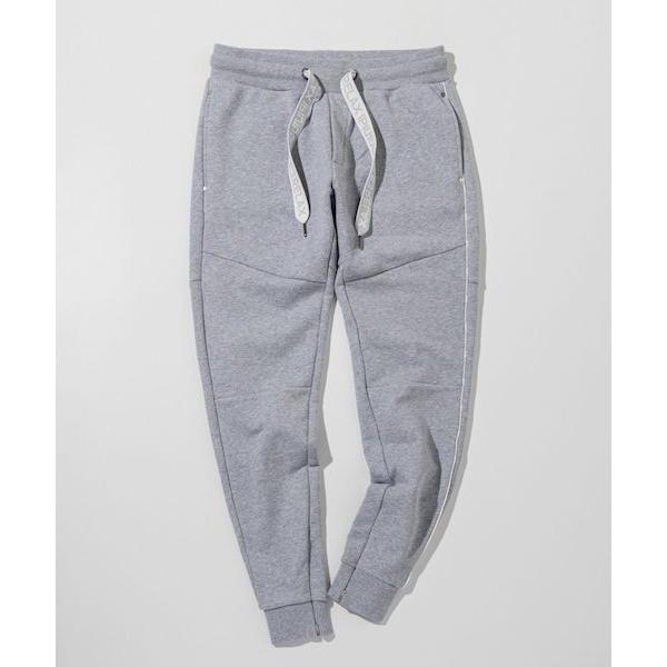 1PIU1UGUALE3 RELAX パイピングロゴワイドスピンドルジョガーパンツ