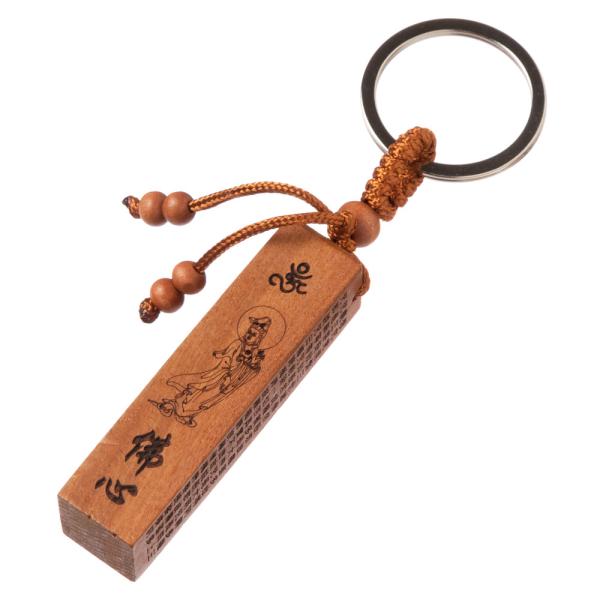 般若心経がぐるりと一周彫られたキーホルダーです。鍵やバッグにつけて、お守りとしてお持ちください。サイズ：約1.3×1.3×長5.5(cm)素材：ナツメ材