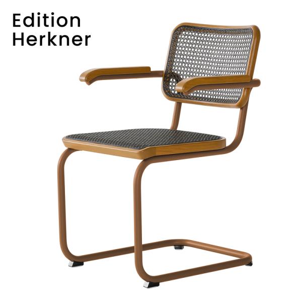 「Edition Herkner」のS64Vは、クラシックなカンチレバーチェアの現代的アレンジです。デザイナーSebastian Herknerが手掛け、座面には深みのあるダークメランジェカラーのケーン（籐編み）を用いた仕様です。フレームと...
