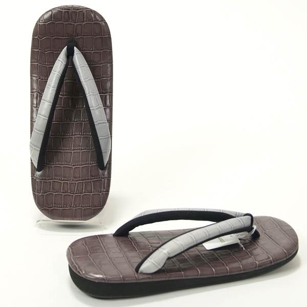 菱屋謹製のカレンブロッソの男性用の雪駄です。在庫品、少々難あり（やけ有）の為、アウトレット品になります。外箱なし台の表面は、ワニ革調型押しになっています。鼻緒もワニ調になっています。鼻緒裏はソフトな生地を使用していますので、足にあたる部分が...