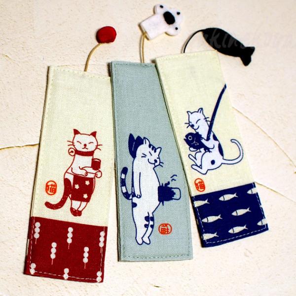 ■メーカー情報：sheepsleep / 日本■製造国：日本■素材：綿・麻■サイズ：約４×１１ｃｍ※手作り品のため若干の誤差がございます本好きの方へ★ハンドメイドの猫柄の布しおり♪sheepsleepさんのちょっと洒落のきいたデザインが心を...