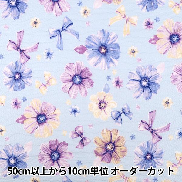 リボンやお花を散りばめたドリーミーな色合いのリップル生地です。さざ波のような凹凸が特長的なこの生地は肌に触れる面積が小さくなるので、べとつかず、サラッとした感触の涼感素材です。子どもの甚平、浴衣、パンツ、シャツ、スカート、チュニック、ベビー...