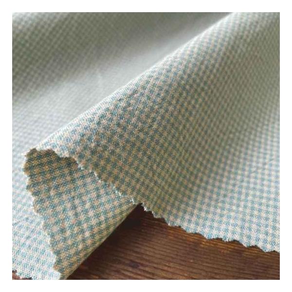 Yarn-Dyed Dobby Check新潟産特有の織りと仕上げにより絶妙な風合いを醸し出しています。タテヨコともに同色系の濃度差の少ない配色でチェックを表現しております。<規格>素材：綿100％布幅：108〜110ｃｍ生産地...