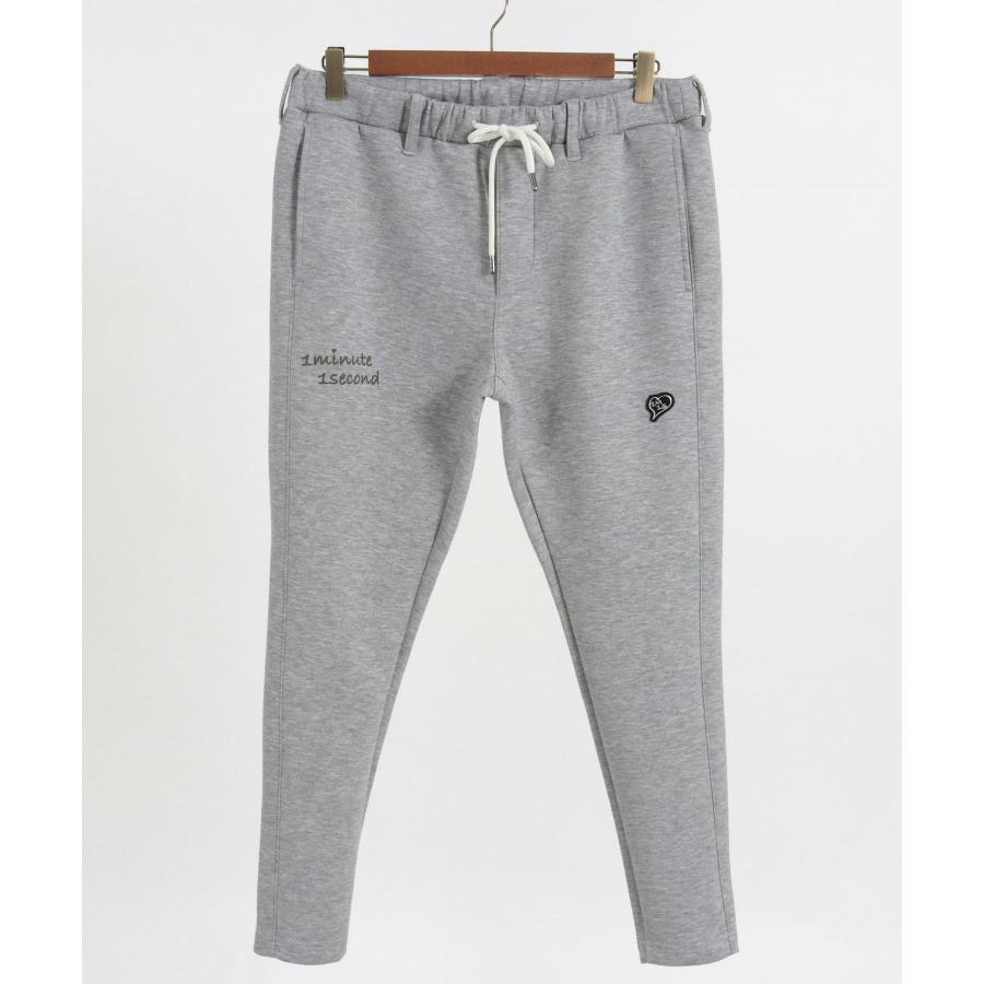 1minute 1second（ワンミニットワンセカンド） パンツ cursive print cardboard knit pants ...