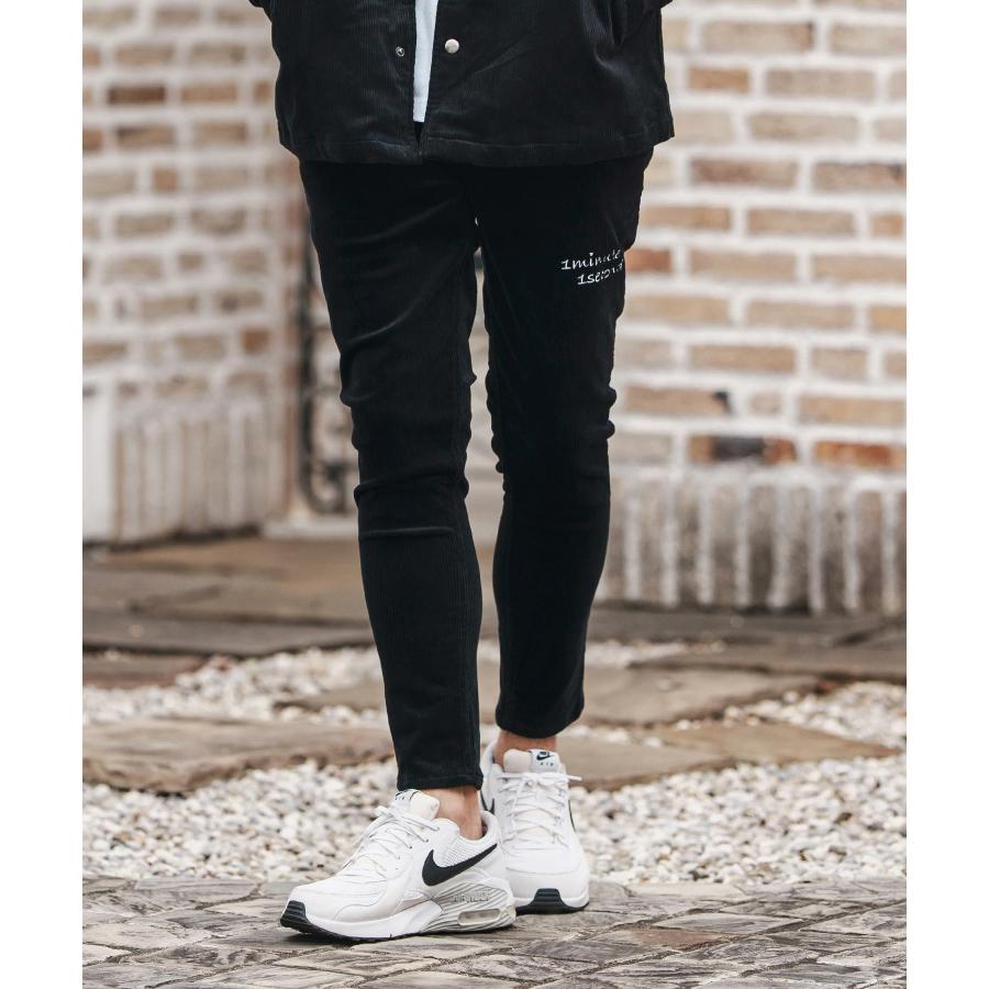 1minute 1second（ワンミニットワンセカンド） corduroy pants with cursive embroidery ...