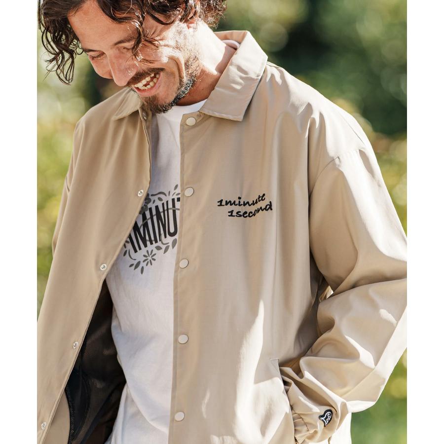 1minute 1second（ワンミニットワンセカンド） coach jacket with cursive embroidery ...