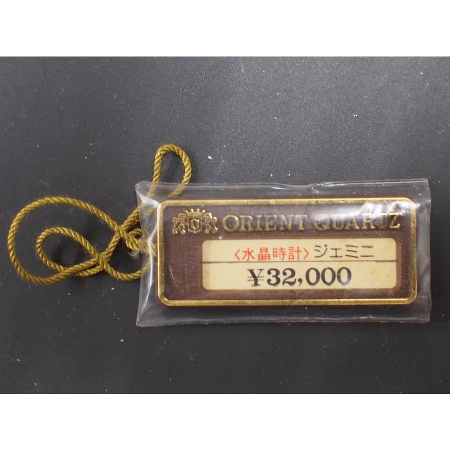 ORIENT オリエント ジェミニ 水晶時計 オールド クォーツ 腕時計用 新品販売時 展示タグ プラタグ Cal: 050107 ...