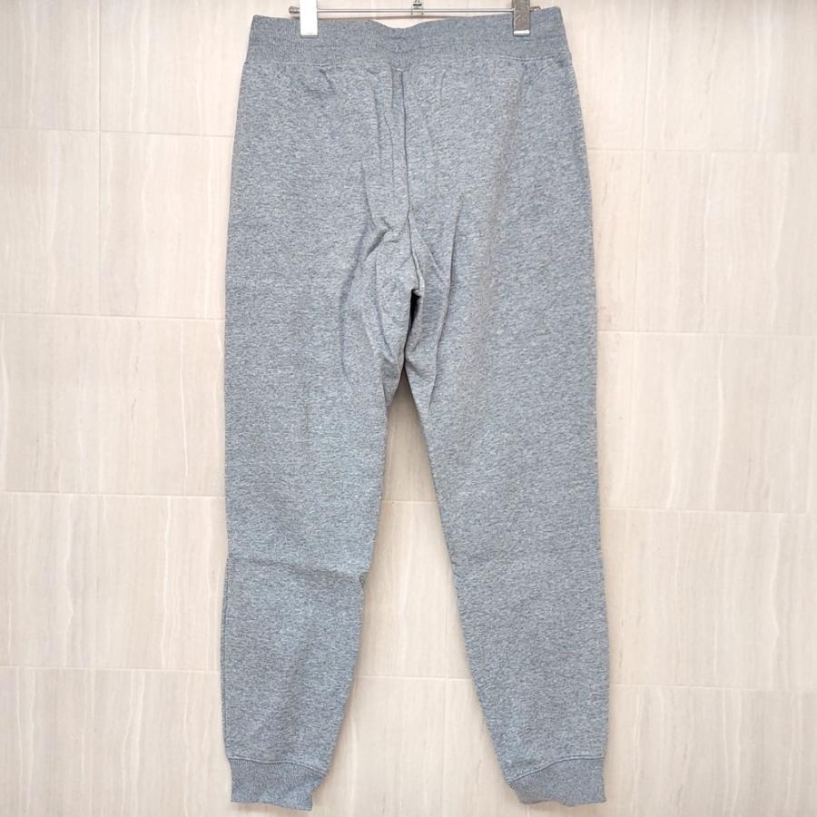 アンダーアーマー 新品 レディース ロングパンツ 1348549 035 M グレー 裏起毛 スポーツスタイル グラフィックパンツ ルーズ ...