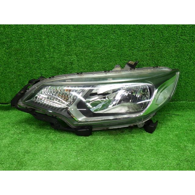 フィット DBA-GK4 左ヘッドランプ/ヘッドライト 13G Lパッケージ 4WD NH578 スタンレー W0349 33150-T5A ...